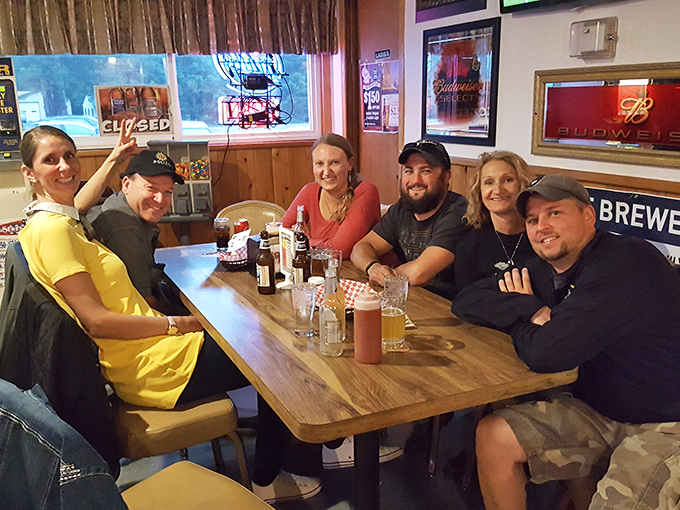 Happy patrons enjoying good company and better food, the true heart of any great local establishment.