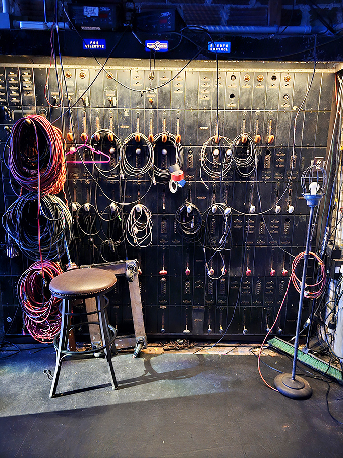 Behind the scenes, the original switchboard reveals the complex infrastructure that powers the magic, a steampunk dream of knobs, wires, and mechanical ingenuity.