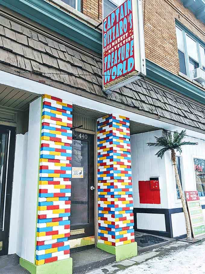 LEGO-inspired entrance columns stand as colorful sentinels to this realm of retail wonder, promising the playfulness waiting inside.