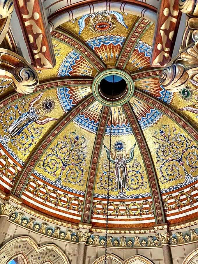 The Garfield Memorial's dome ceiling explodes with golden mosaics, creating a heavenly canopy above the president's final resting place.