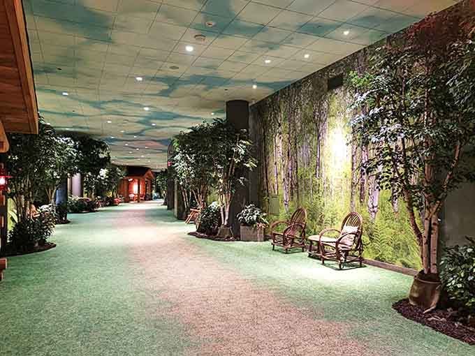 Nature comes indoors along this enchanted forest pathway, where artificial skies and real trees create a perpetual perfect day.