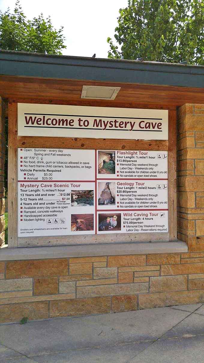 Visitor information central: This sign outlines the various tour options, from the family-friendly Scenic Tour to the adventurous Wild Caving experience.