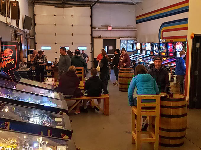Weekend warriors gather in their natural habitat, surrounded by the games that defined their youth but with adult beverages in hand.