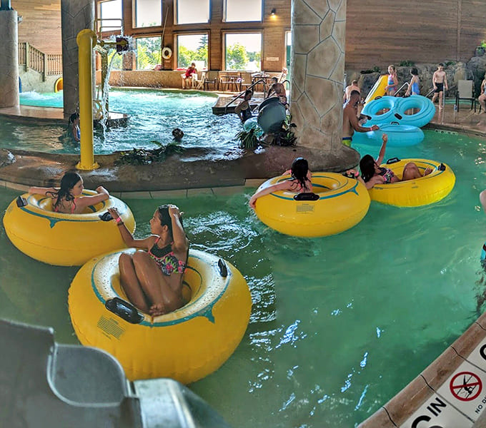 The lazy river becomes a social highway as inner tubes carry relaxed passengers through the gentle current &ndash; vacation mode: fully activated.