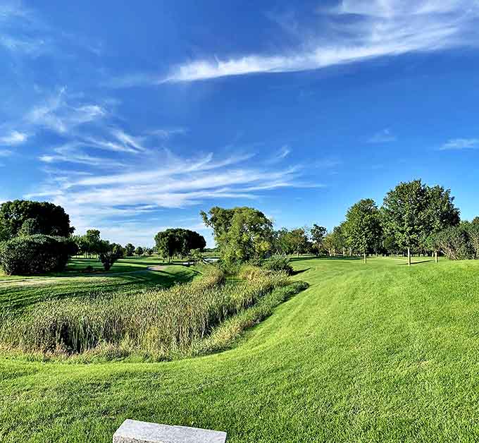 Litchfield Golf Course unfurls like a green carpet between stands of trees, offering both challenging play and scenic views that distract from even the worst slice.