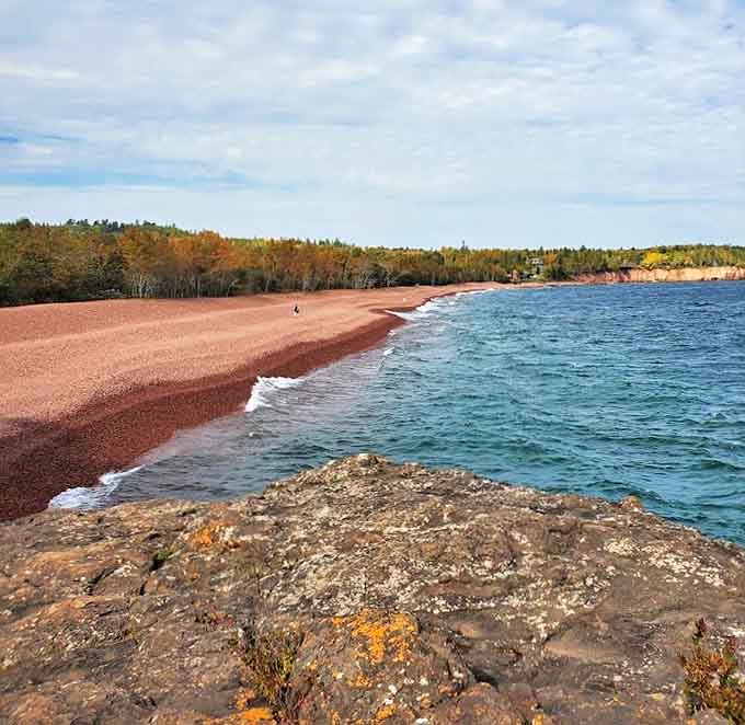 The graceful arc of Iona's Beach stretches into the distance, each stone polished by countless waves over millennia.