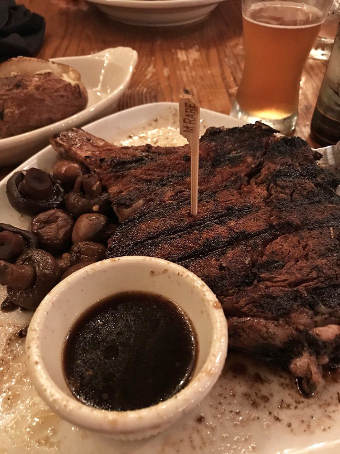A perfectly cooked ribeye with those famous marinated mushrooms – the kind of plate that makes you consider licking it clean.