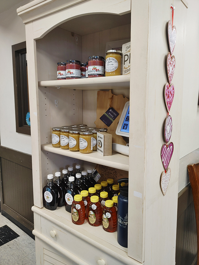 Shelves stocked with local honey and maple syrup, extending the bakery's commitment to regional flavors.