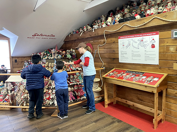 A mother and children explore the educational exhibits, discovering the rich history behind these beloved American folk toys.