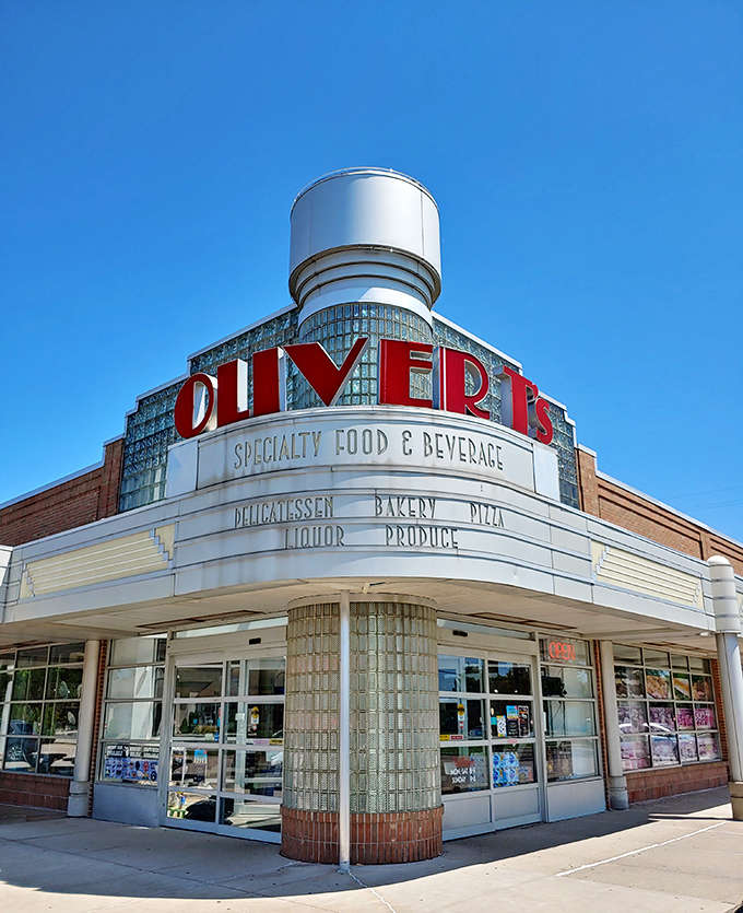 Under clear blue skies, the Oliver T's storefront stands as a monument to good taste, its glass blocks gleaming with promise.