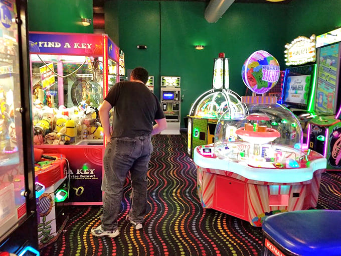 A blinking, beeping paradise of entertainment where generations bond over the timeless joy of trying to beat the high score.