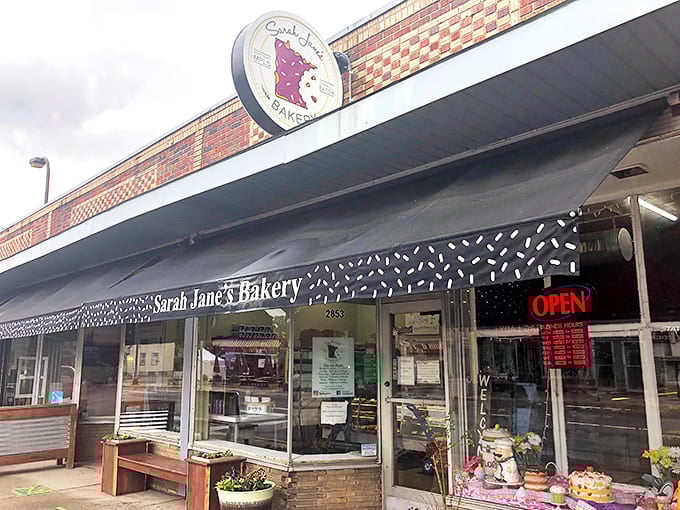 Even on cloudy days, Sarah Jane's storefront radiates warmth and welcome, with seasonal planters adding homey charm to the entrance.