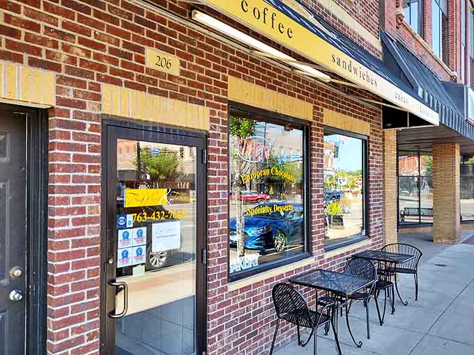 The sidewalk view offers a glimpse into sweetness waiting inside, with outdoor seating for those who prefer their sugar with a side of fresh air.