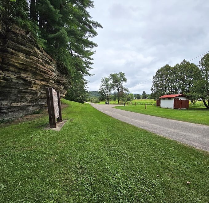 Moss-kissed stone walls create a natural corridor, inviting hikers to discover what lies beyond the next bend.