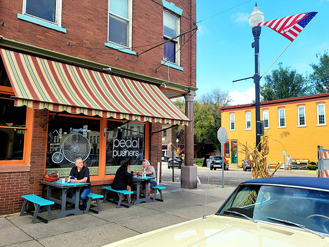 At Pedal Pushers Cafe, sidewalk dining becomes an impromptu community gathering, where food connects strangers and fuels adventures on the trail.