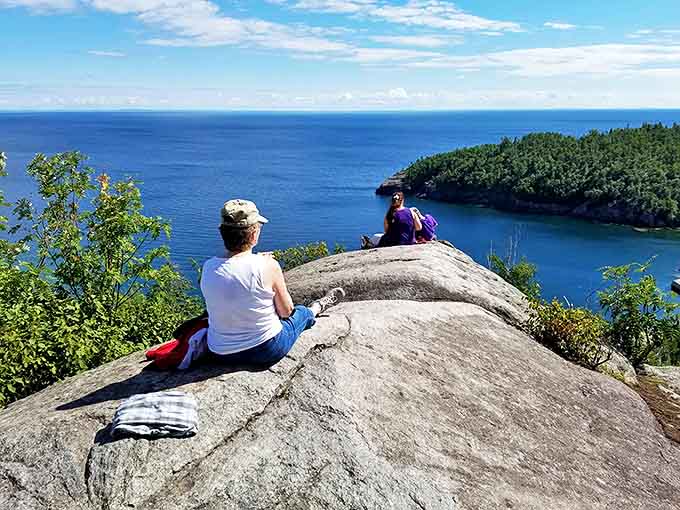 These visitors have found the perfect rock to contemplate life's big questions, like "How is this view even real?"