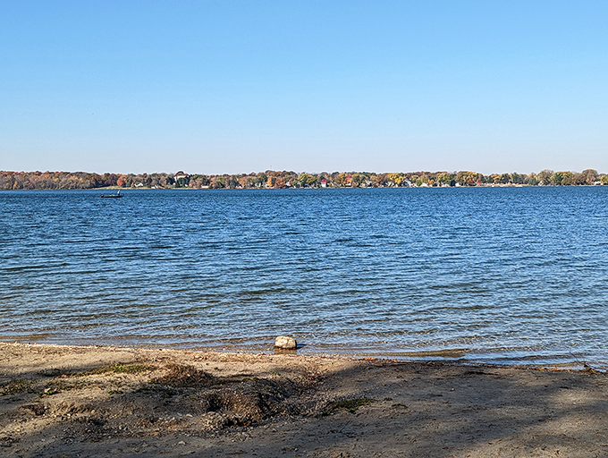 Pike Lake's shoreline offers a moment of reflection, where water meets sky in perfect Midwestern harmony.