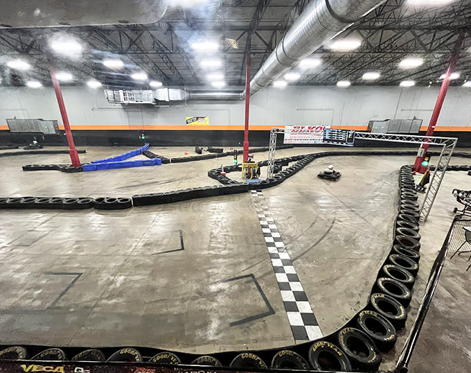 The cavernous racing space ensures plenty of room for high-speed maneuvers while the industrial design adds authentic racing atmosphere.
