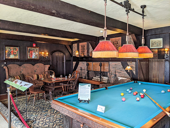 This cozy billiards room blends rich wood beams and vintage charm for a warm, old-world escape.