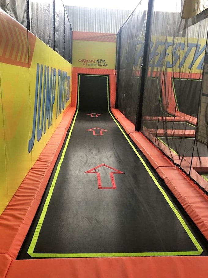 The runway trampoline invites jumpers to literally bounce off the walls, turning ordinary humans into temporary superheroes with each leap.