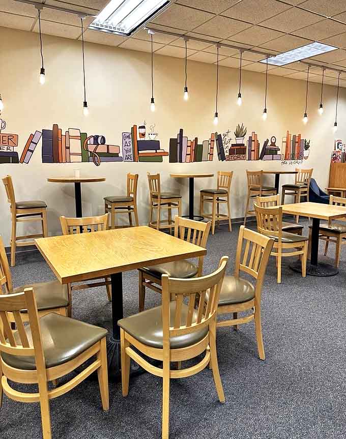 Cozy seating areas with pendant lights and painted bookshelves on the wall create the perfect ambiance for losing yourself in a story.