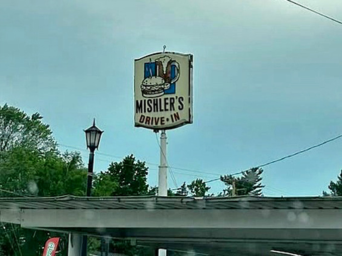 Landmark beacon: Mishler's iconic sign has guided hungry travelers for decades, a siren call to those seeking authentic drive-in delights.