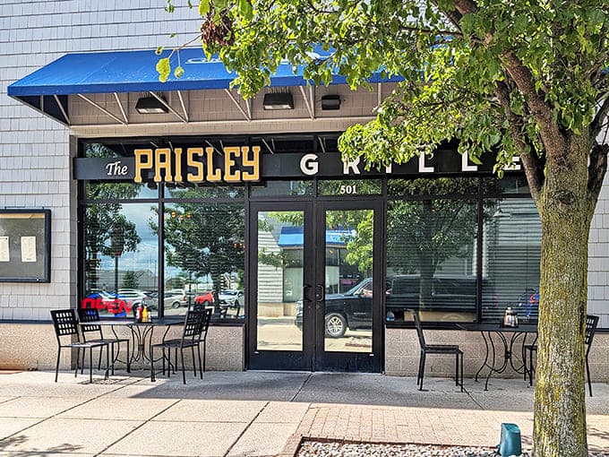 Daytime reveals The Paisley Pig's charming exterior, where the blue awning signals good things await those smart enough to enter.