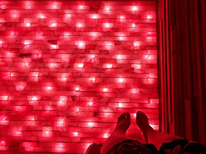 The red-hued therapy room looks like Mars if Mars were made of salt and designed specifically for human relaxation.