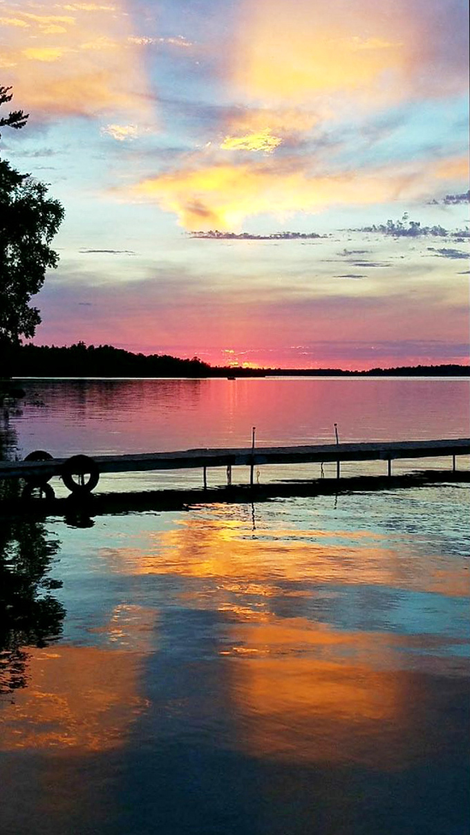 Nature's grand finale: Deer Lake's sunset transforms water into liquid gold, creating the perfect Minnesota moment to end the day.