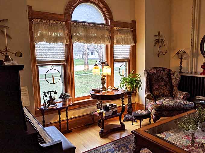 Sunlight filters through arched windows onto antique furnishings, creating the perfect setting for both morning coffee and evening contemplation.