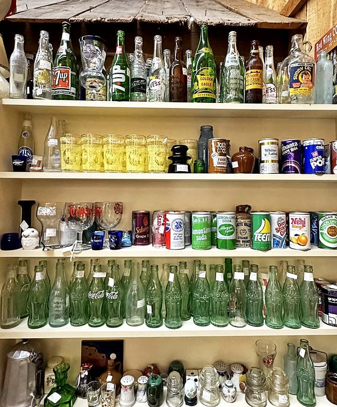 The soda bottle shrine &ndash; where vintage Coca-Cola meets forgotten brands in a fizzy time capsule of American refreshment history.