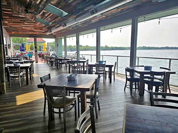 Floor-to-ceiling windows frame Walled Lake like a living painting, allowing diners to enjoy the view in climate-controlled comfort year-round.