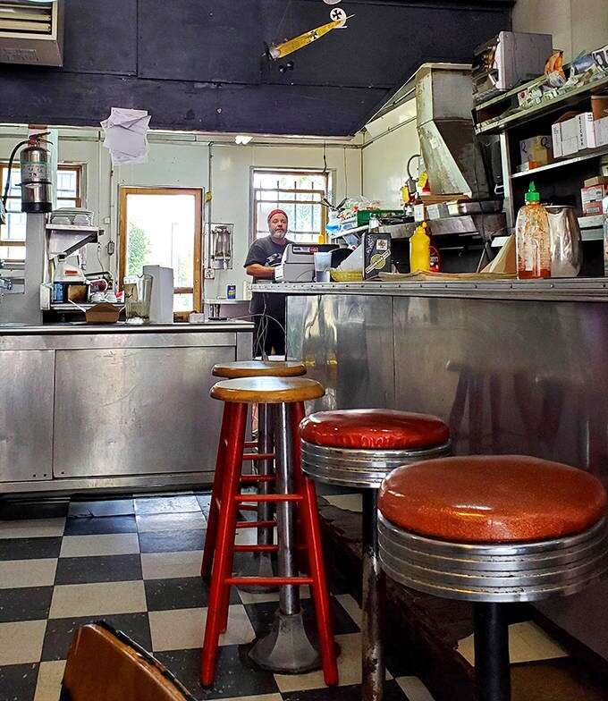 Model airplanes hang from the ceiling while memorabilia lines the walls, creating a museum-like atmosphere that rewards repeat visits.