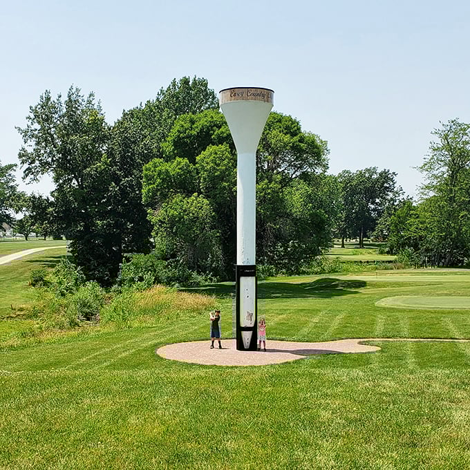 Golfers stand in awe beneath the world's largest tee. This monument to the gentleman's game makes even professional athletes look tiny by comparison.