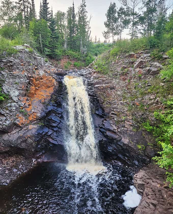 Up close, the waterfall reveals its personality &ndash; not just one flow but hundreds of individual water pathways finding their own route down.