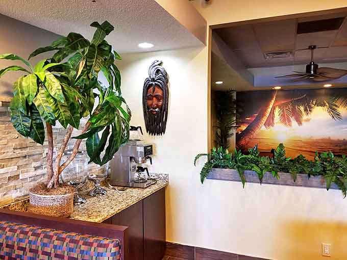 The beverage station, where tropical plants frame the coffee area, creating a perfect spot for morning island vibes.