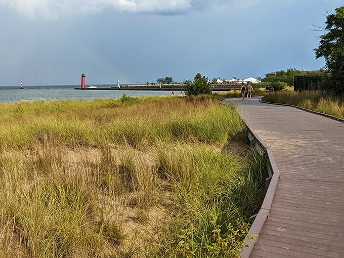 Boardwalk wanderings: Where wooden pathways lead through dune grasses toward blue horizon promises.