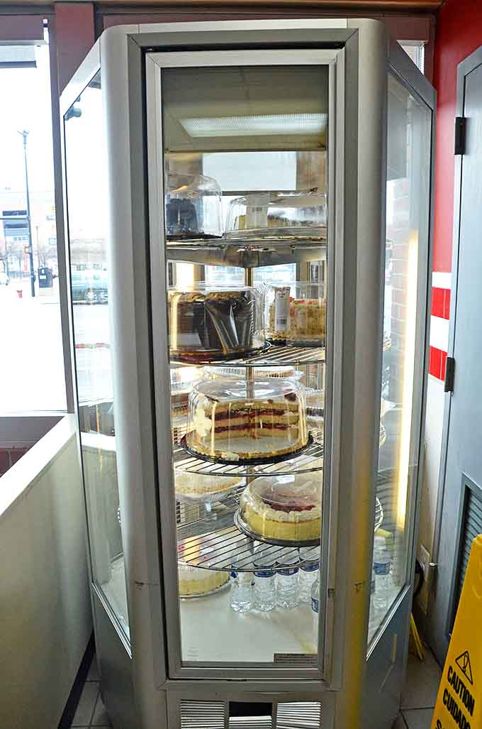 The rotating cake display &ndash; a circular stage where desserts perform their siren song to willpower-challenged diners everywhere.