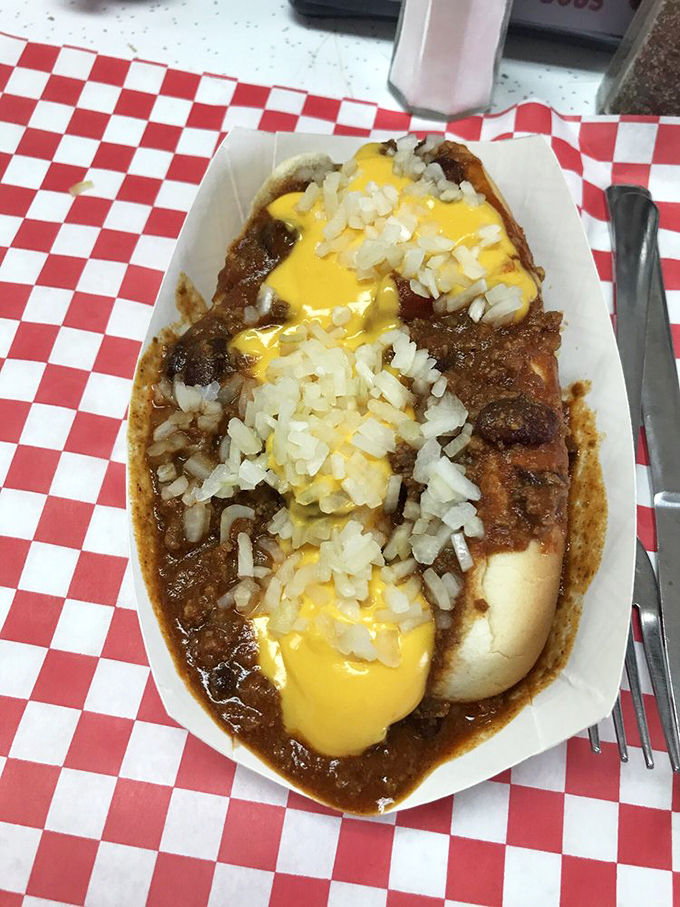 This chili dog doesn't just sit in its boat&mdash;it commands it, with melted cheese and diced onions standing at attention like delicious little sailors.