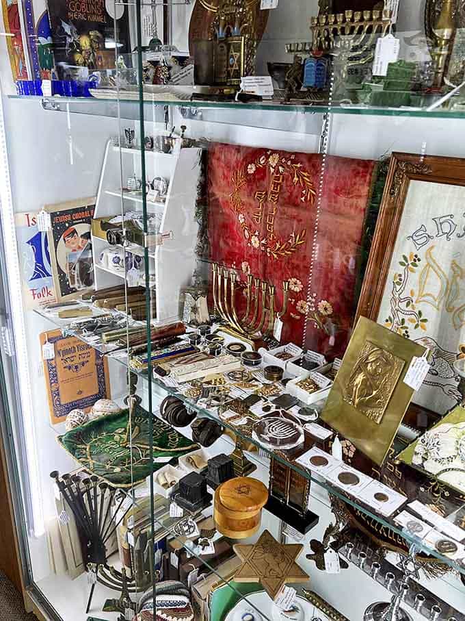 This carefully arranged display of Judaica represents cultural heritage preserved through objects both ceremonial and everyday, each with its own significance.