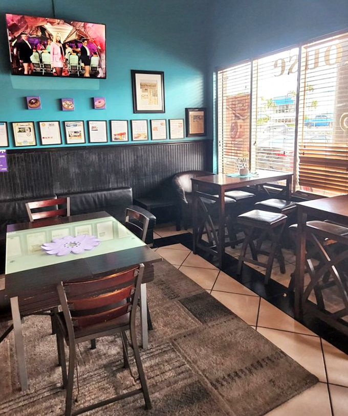 Teal walls and wooden tables create a modern-retro vibe &ndash; the perfect setting for contemplating life's important questions, like "Should I get a second donut?"