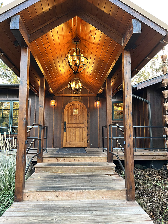 An entrance that feels like a warm welcome &ndash; wooden beams and golden light creating the perfect prelude to an unforgettable meal.