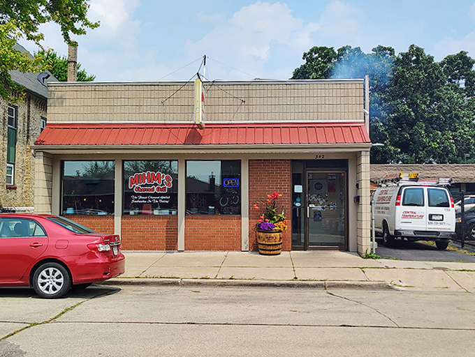 The unassuming entrance belies the culinary treasures within. This modest doorway has welcomed generations of hungry Wisconsinites.
