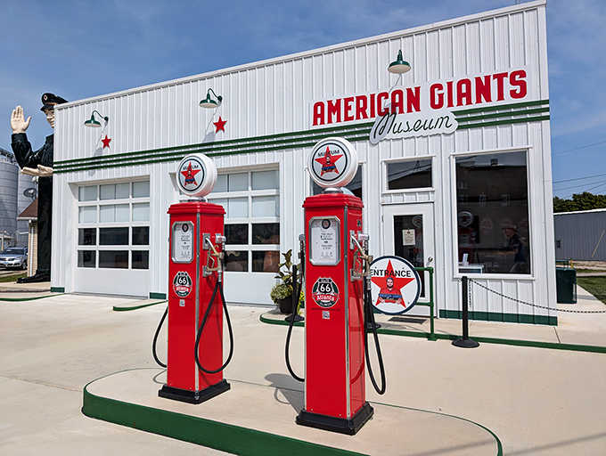 The museum's exterior recreates a classic service station complete with vintage pumps, creating the perfect setting for these roadside giants.