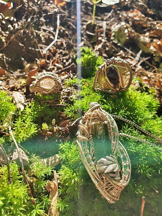 Artisan offerings nestled among moss &ndash; these handcrafted treasures echo the natural beauty surrounding them in this hidden Ohio sanctuary.