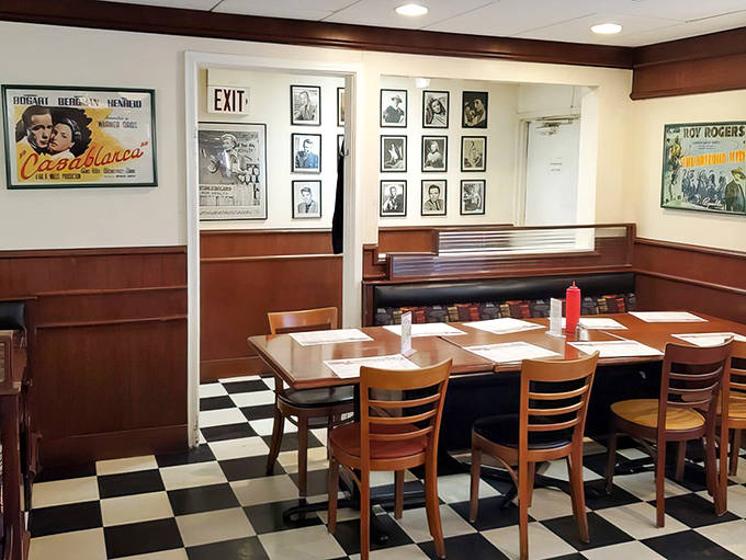 Warm wood tones and classic booth seating create intimate dining spaces where conversations flow as freely as the coffee refills.