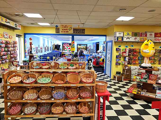 Wooden barrels cradle colorful candy treasures like pirates' chests, inviting visitors to dig for sweet gold in this sugar-dusted paradise.