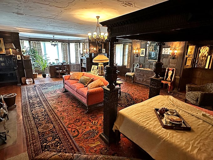 Ornate woodwork frames this bedroom where period furnishings transport visitors to an era when "casual Friday" meant only five outfit changes.