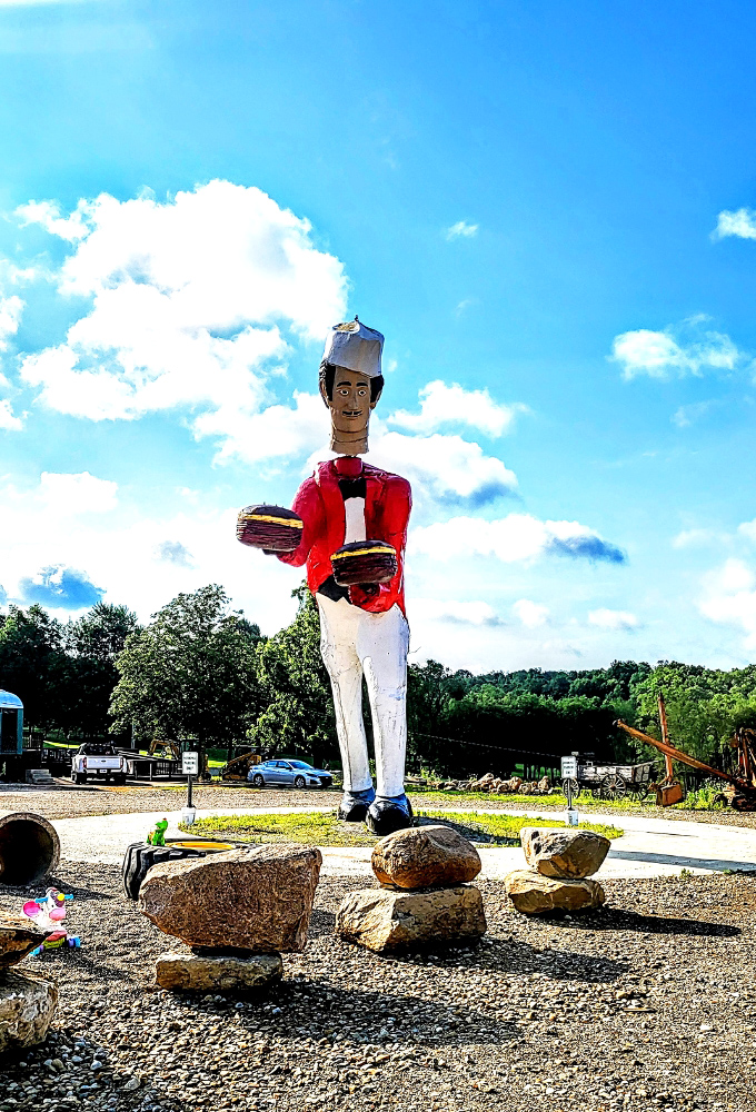 Chef Jacques' face features a perpetually pleased expression, as if he's just served the perfect burger to a satisfied customer.