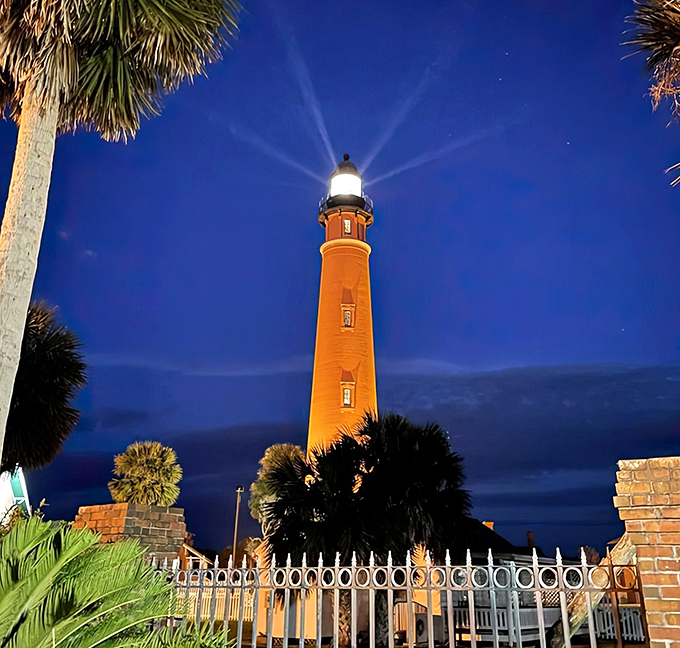 Magic hour becomes magical night as the lighthouse beam cuts through twilight, creating a star-like effect that's been guiding mariners since the days of wooden ships.
